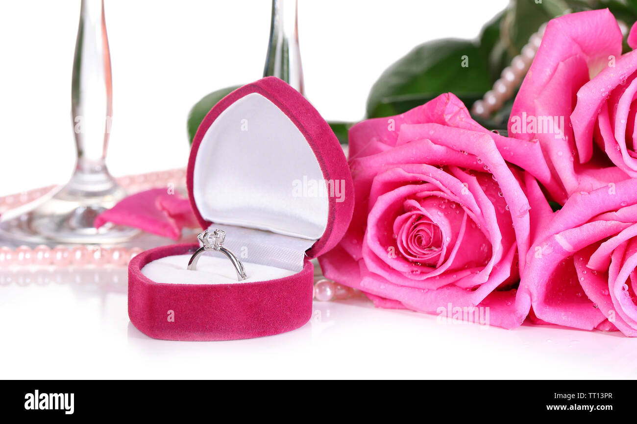 Composition with pink sparkle wine in glasses, bottle and pink roses ...