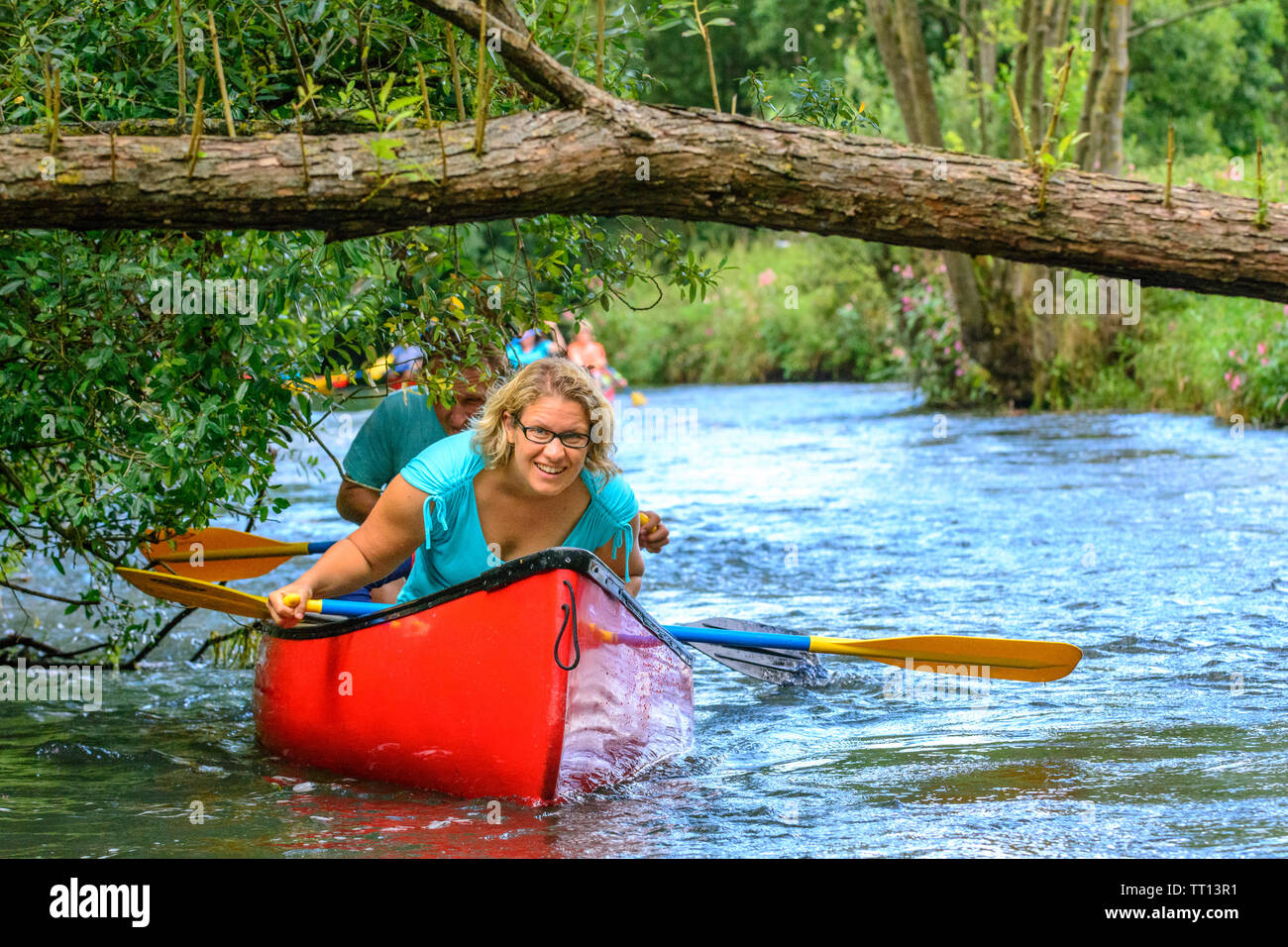 Seveal people making canoe tour on idyllic river called Pegnitz in ...