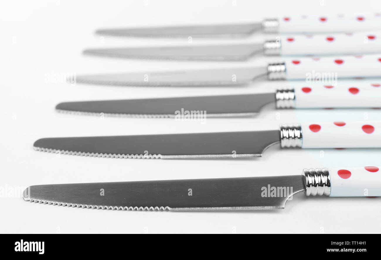Silver knives isolated on white Stock Photo - Alamy
