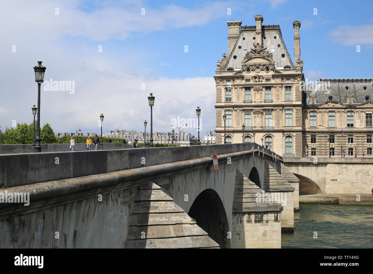 View of the Louvre Palace from the Seine river bank bridge Stock Photo ...