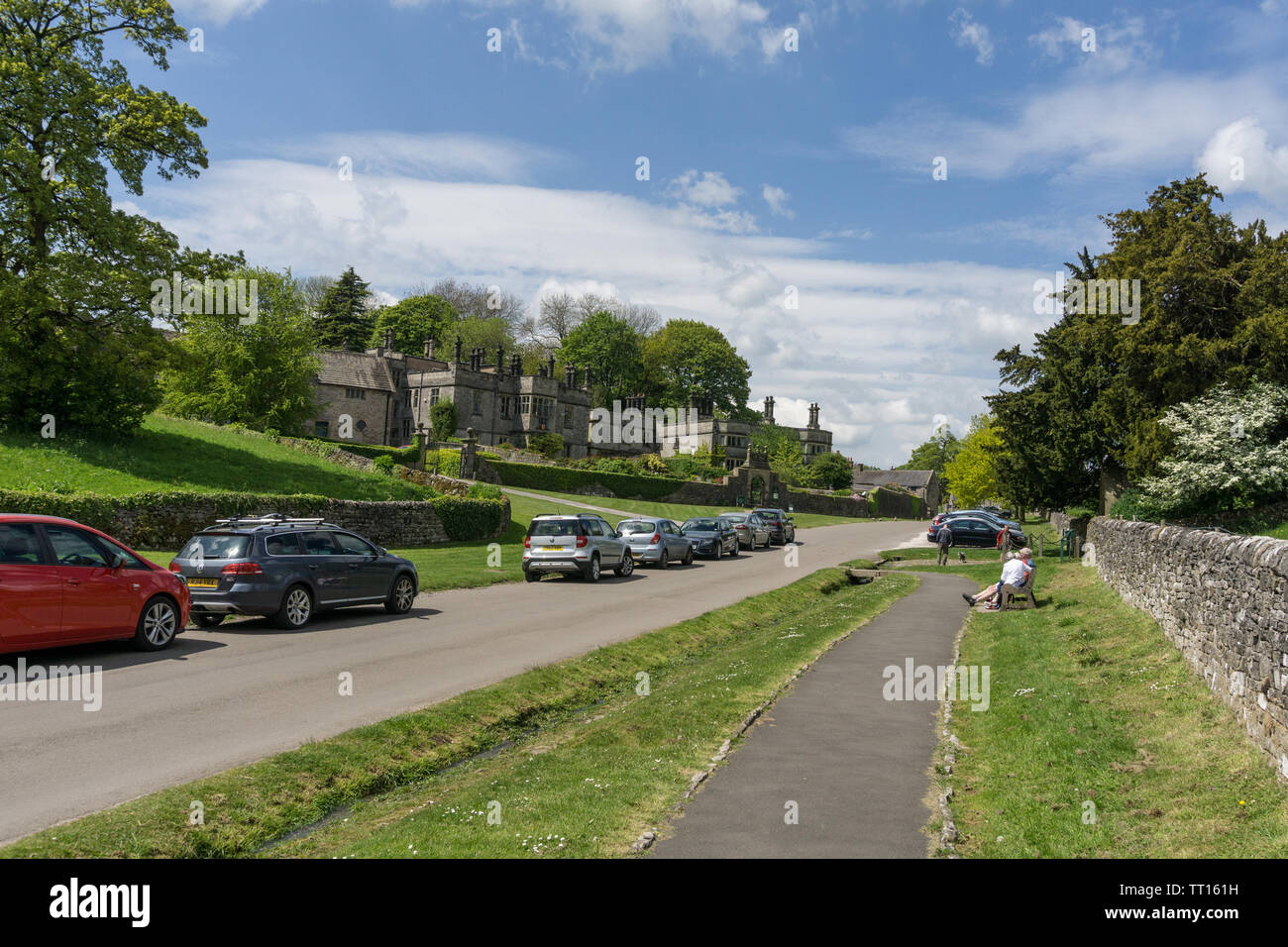 The main street in the pretty village of Tissington, Peak District, UK ...