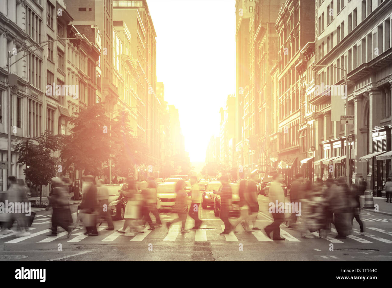 Crowd of people in motion across a busy sidewalk in Manhattan New York ...