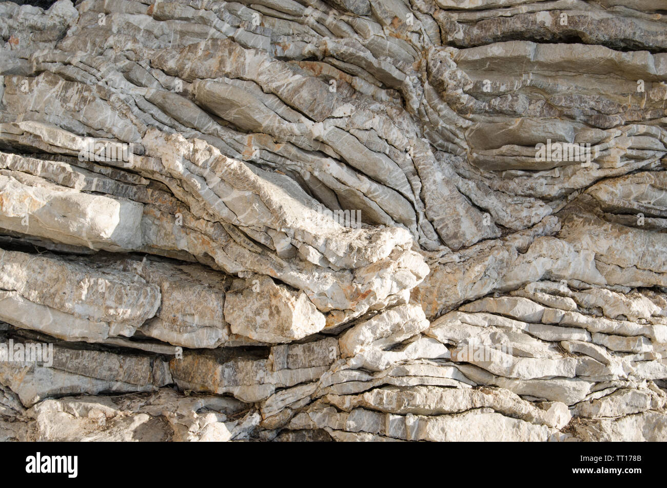 Rock, the background of the layers of ancient sediments.Layered stone ...