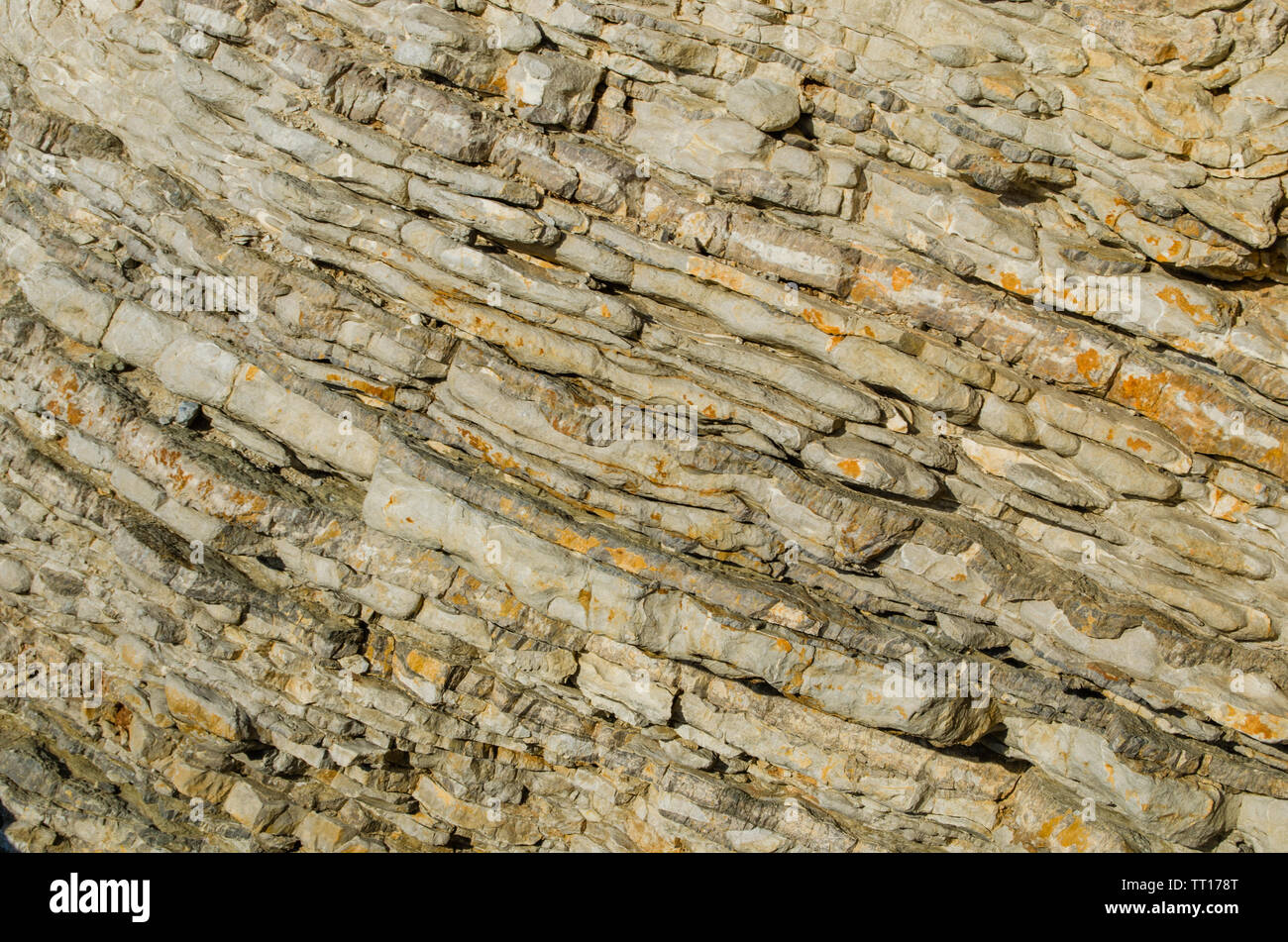 Rock, the background of the layers of ancient sediments.Layered stone ...