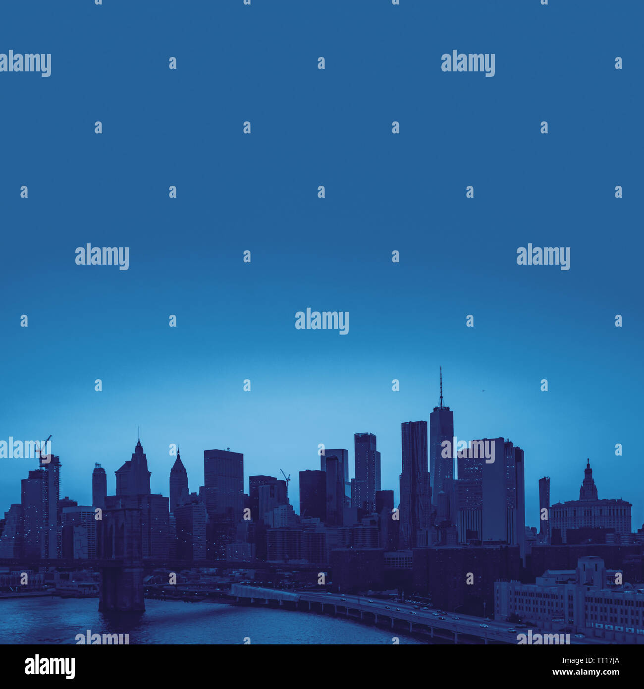 Blue New York City skyline buildings in Manhattan with Brooklyn Bridge ...