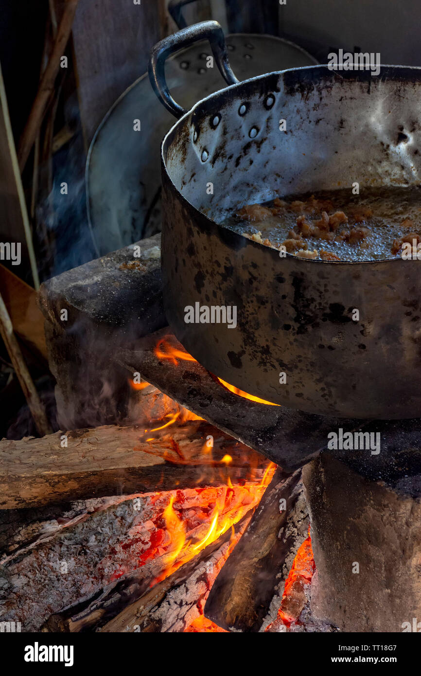 Traditional Brazilian food being prepared on old and popular wood stove ...