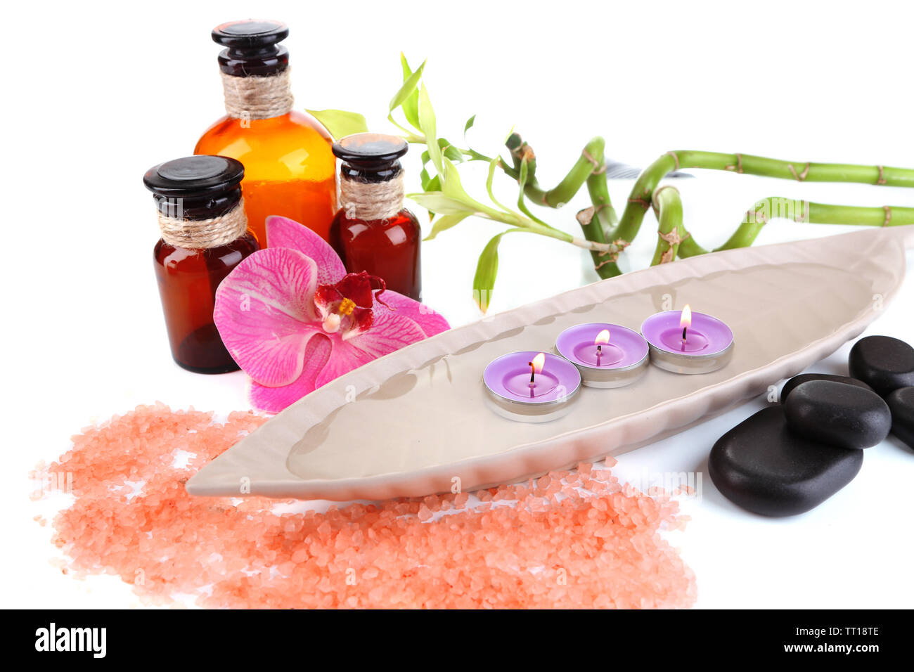 Beautiful spa setting with flower isolated on white Stock Photo - Alamy