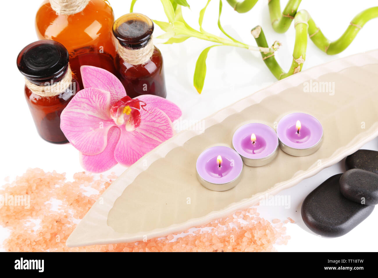 Beautiful spa setting with flower isolated on white Stock Photo - Alamy