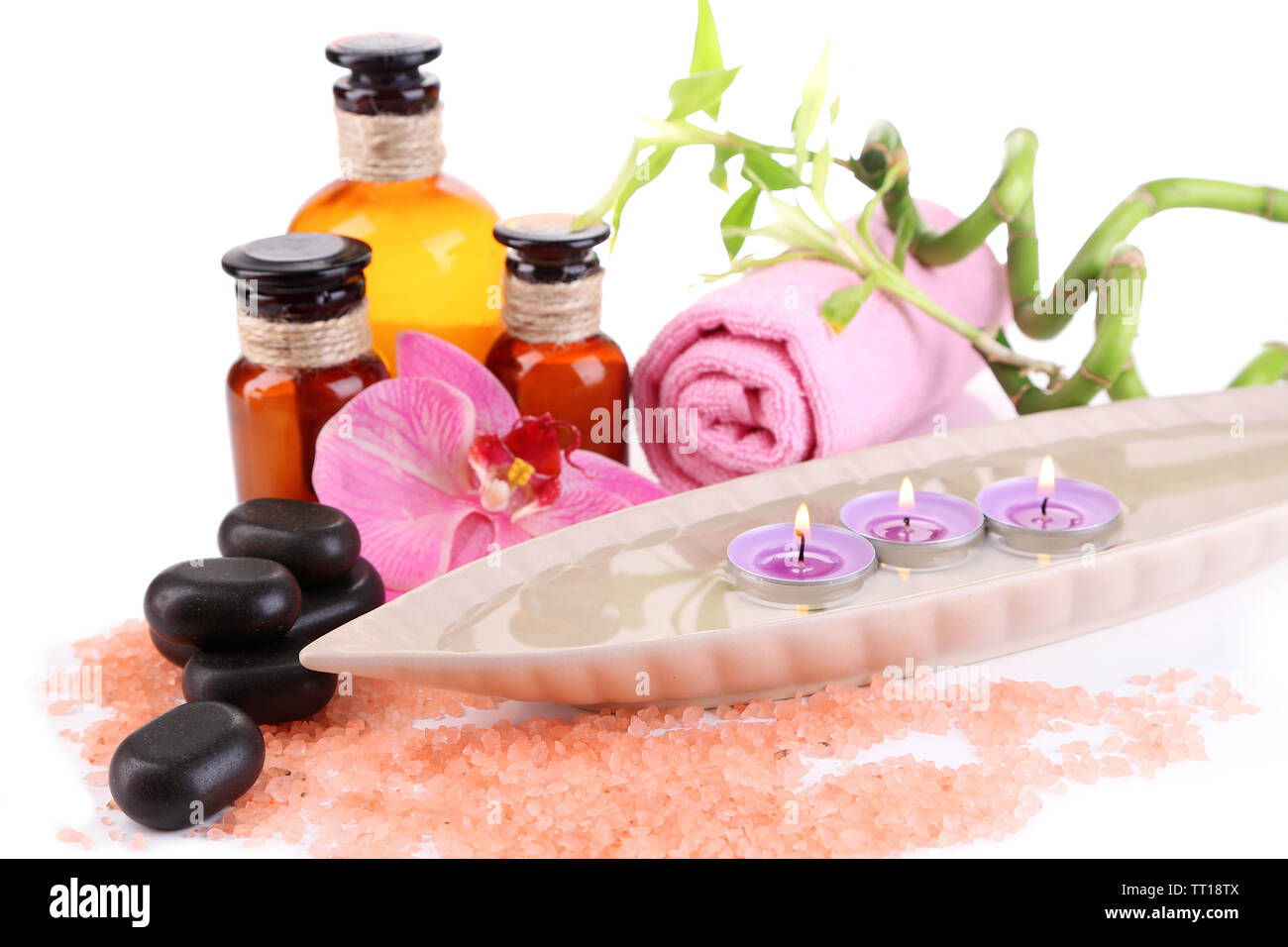 Beautiful spa setting with flower isolated on white Stock Photo - Alamy