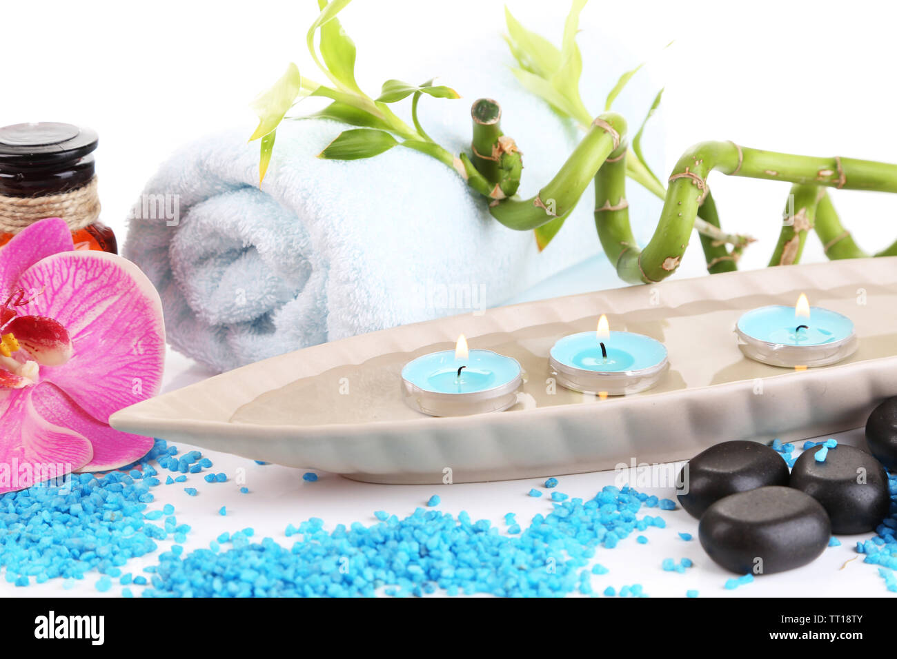 Beautiful spa setting with flower isolated on white Stock Photo - Alamy