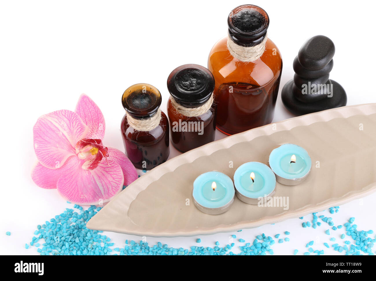 Beautiful spa setting with flower isolated on white Stock Photo - Alamy