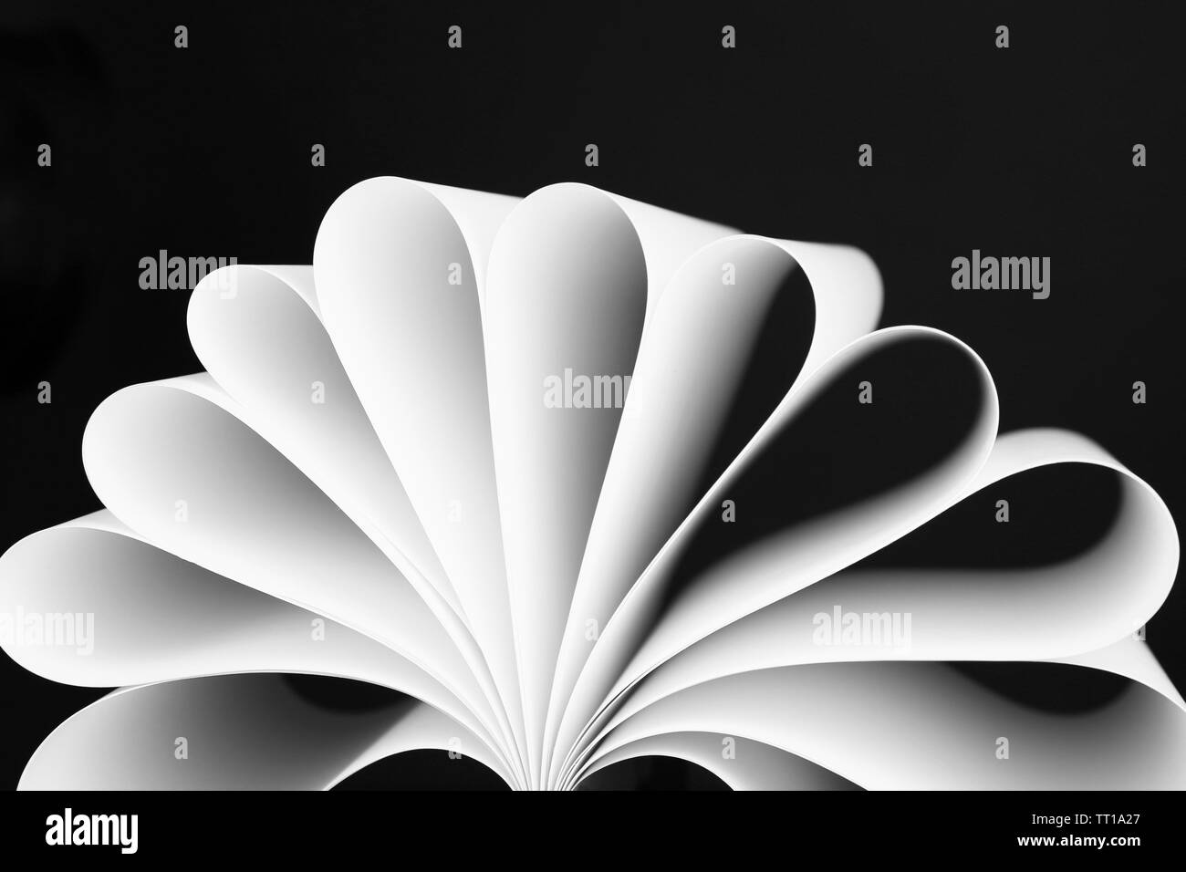 Abstract image of sheets white paper wave shape on black background ...