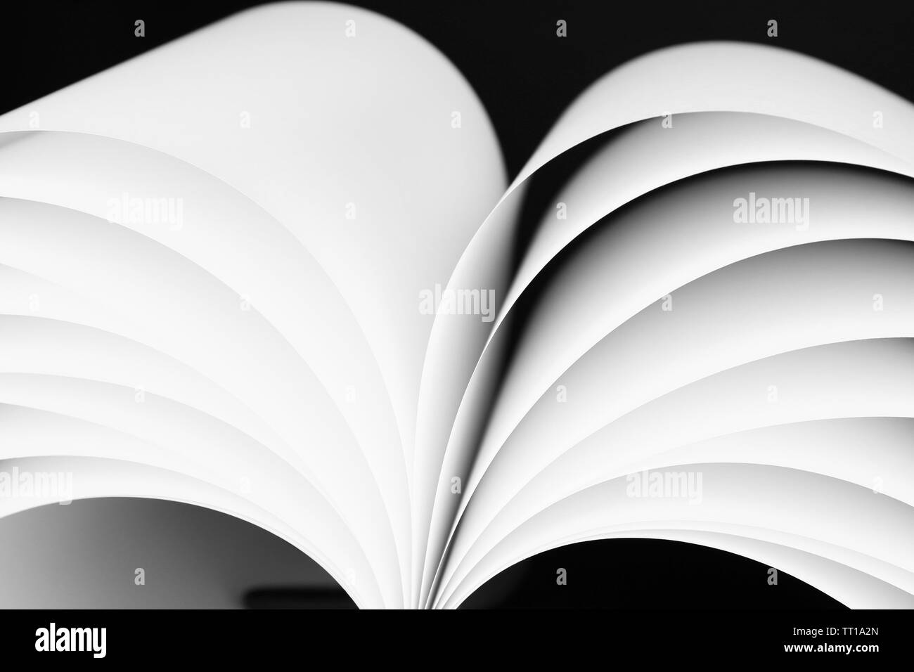 Abstract image of sheets white paper wave shape on black background ...