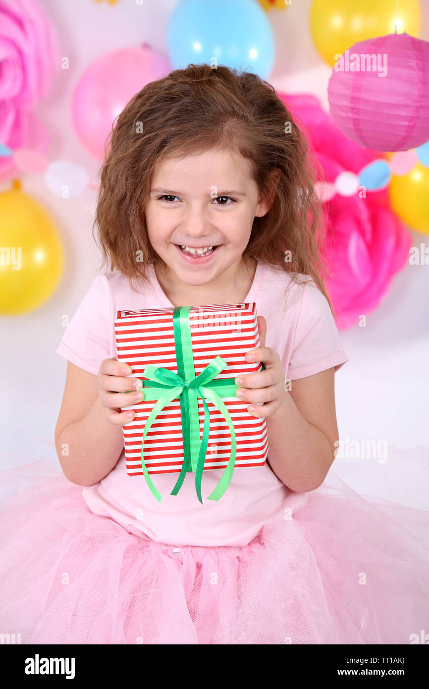 Pretty little girl with gift celebrate her birthday Stock Photo - Alamy