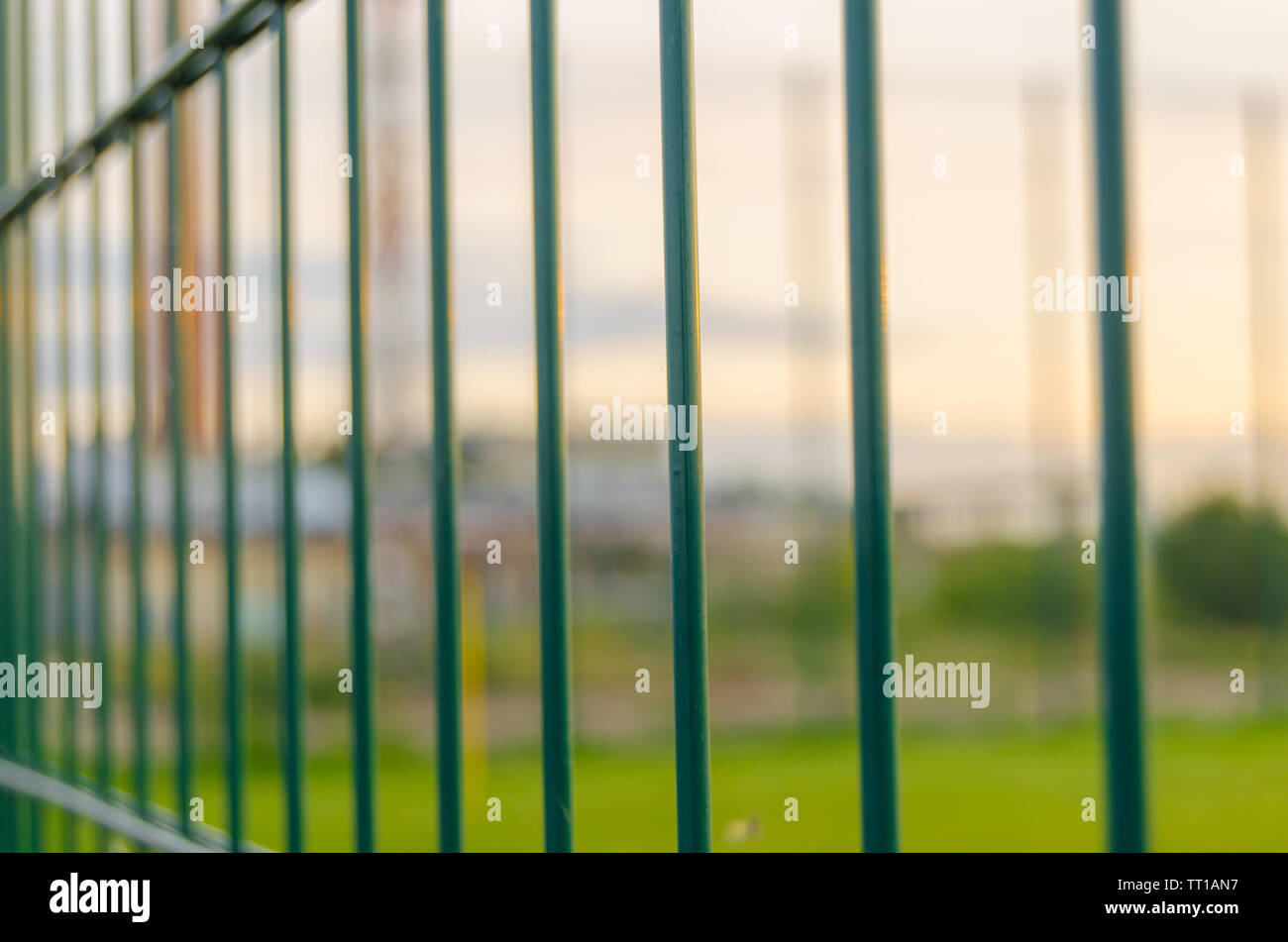 Fencing football field of metal mesh Stock Photo - Alamy