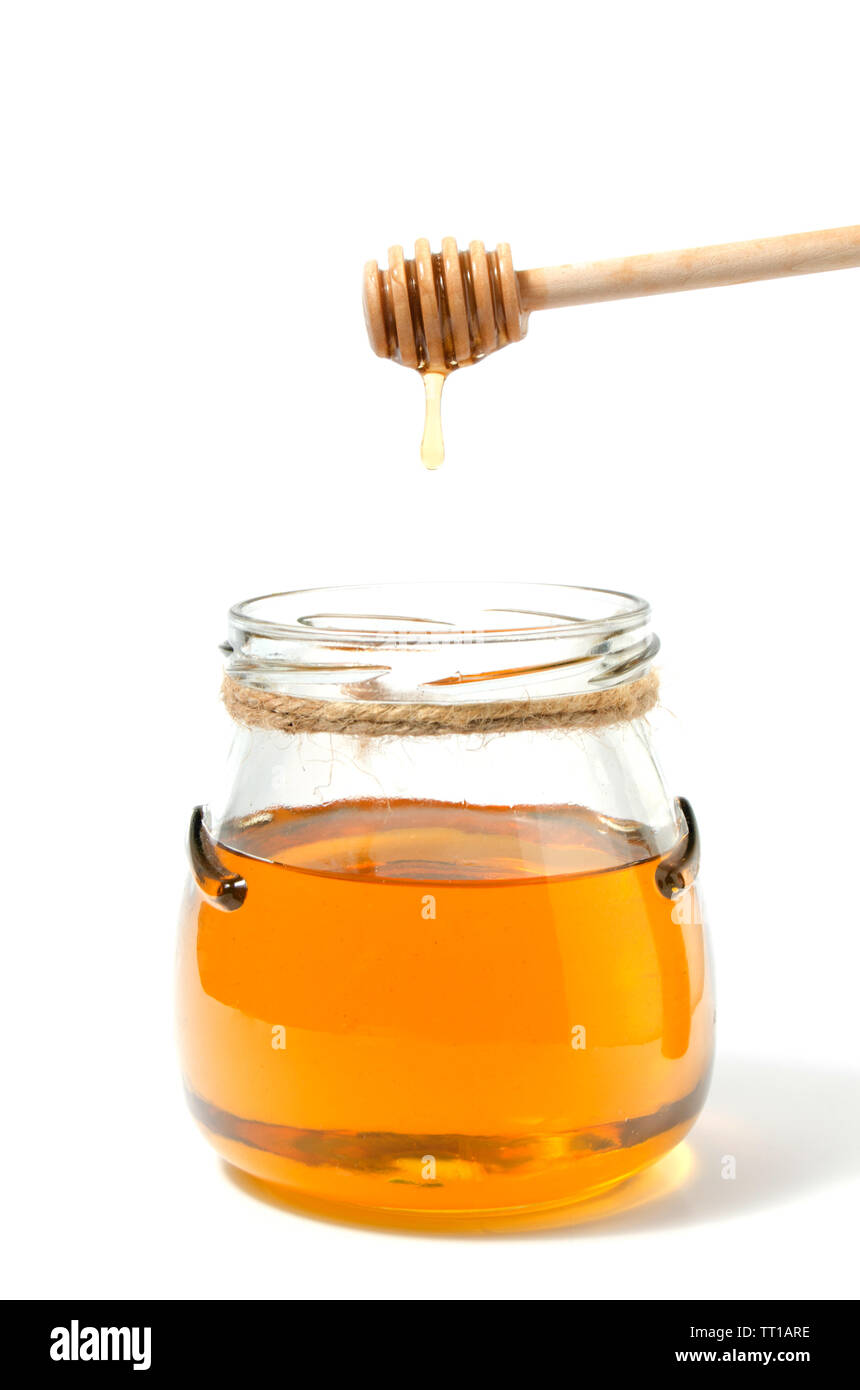 Natural fresh honey and honey spoon on white background.Close up Stock ...