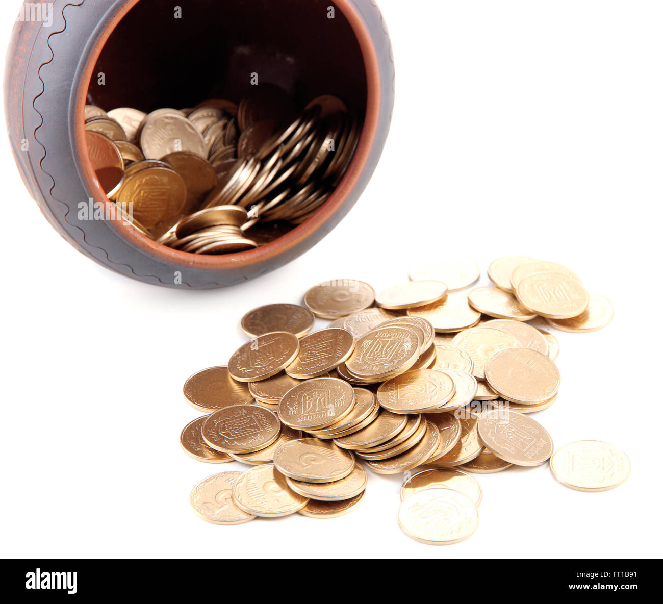 Golden coins falling out from pot, isolated on white background Stock ...