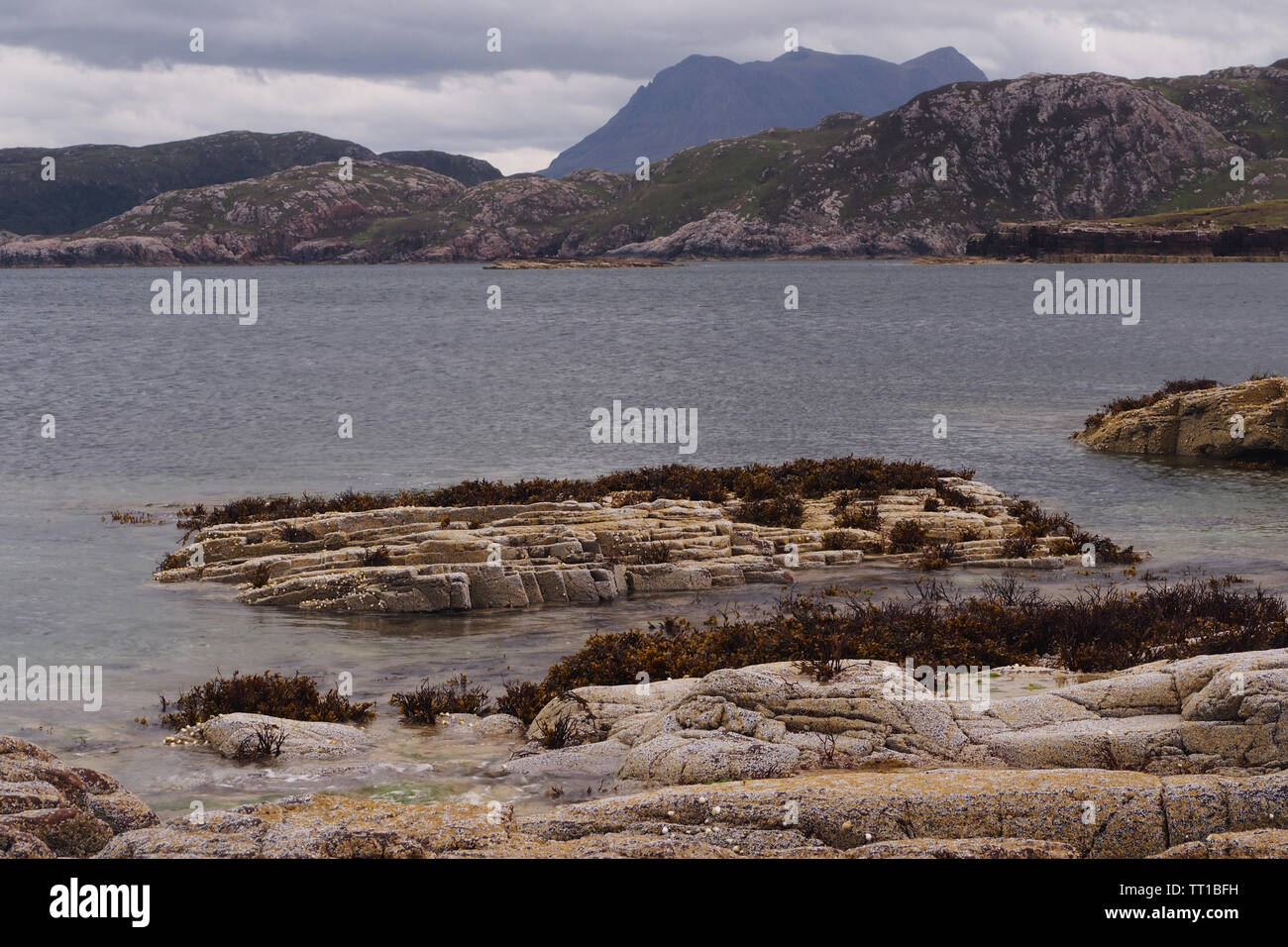 A view across Loch Fionn in the Coigach Peninsula, Scotland with ...