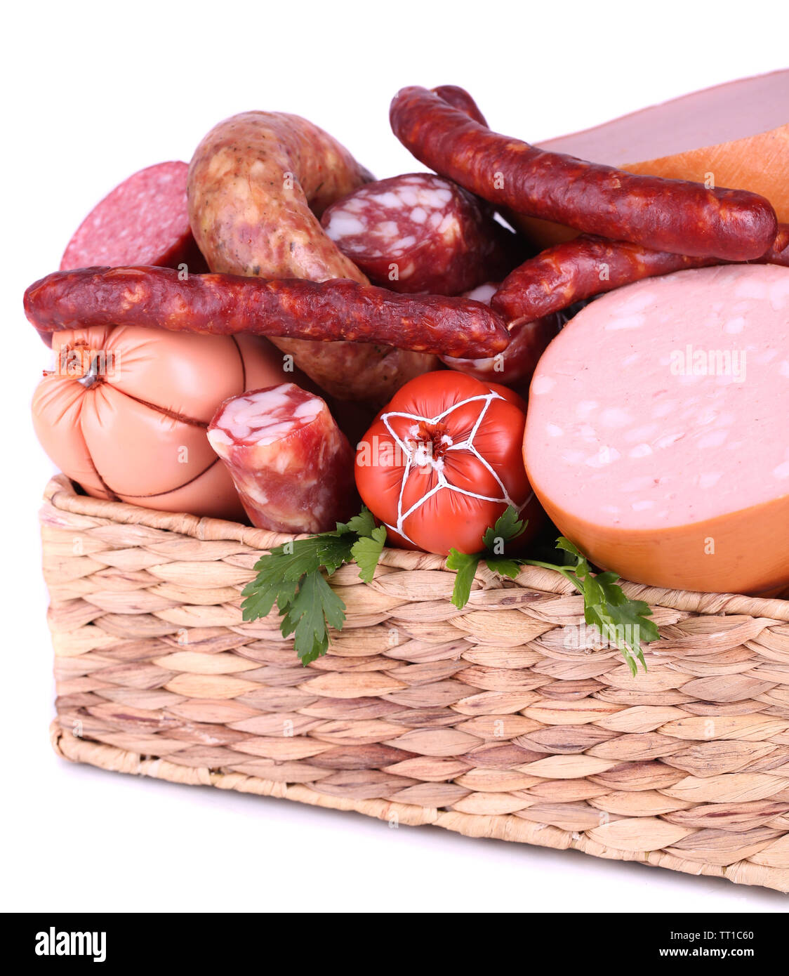 Lot of different sausages in basket isolated on white Stock Photo - Alamy