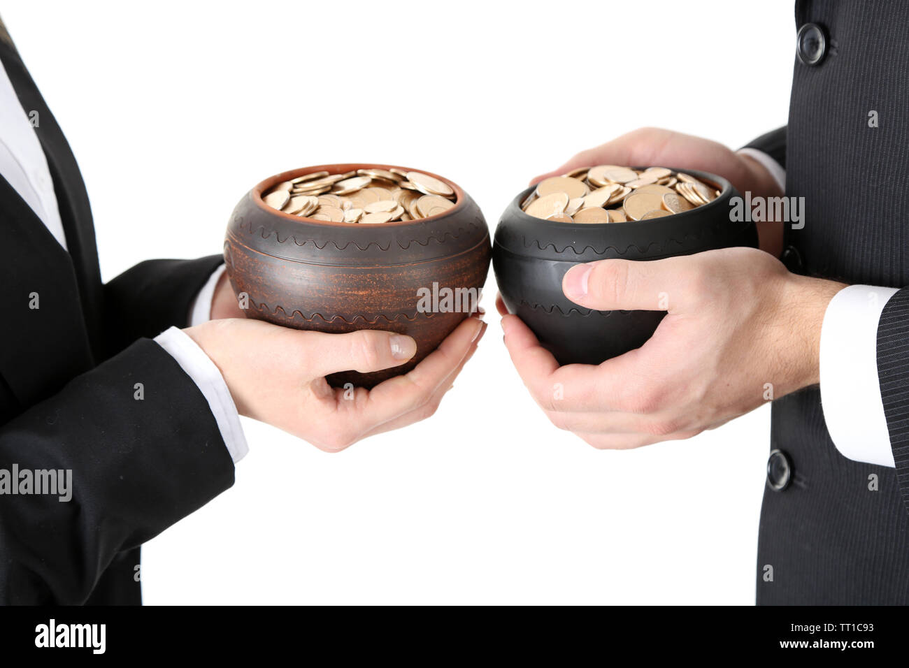Two ceramic pots with golden coins in male and female hands, isolated ...