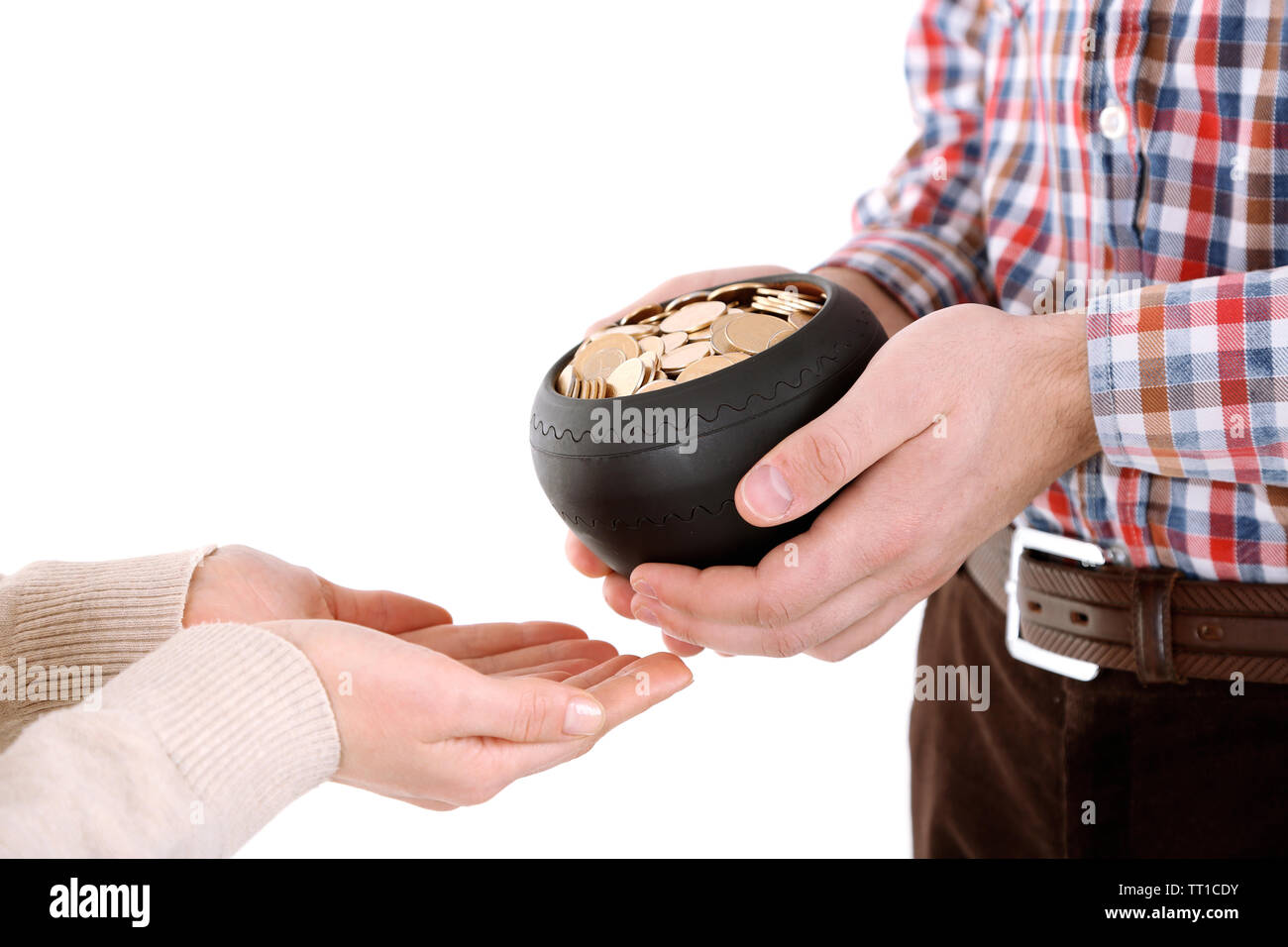 Ceramic pot with golden coins in male and female hands, on light ...