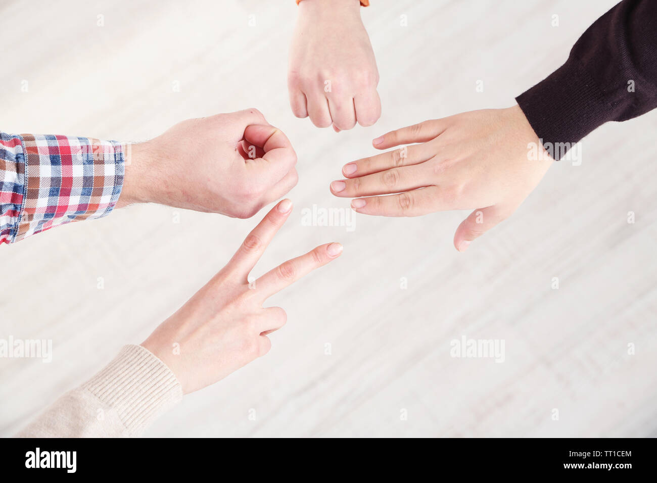 Scissors, paper, stone, scissors - hands on light background Stock ...