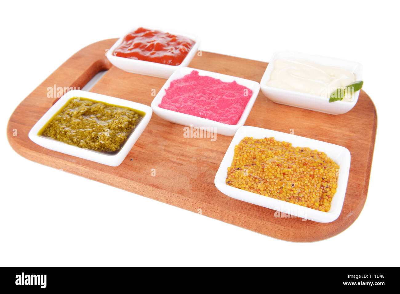 Various sauces on chopping board isolated on white Stock Photo - Alamy