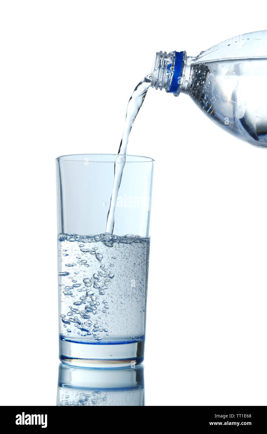 Pour water from bottle into glass, on light blue background Stock Photo ...