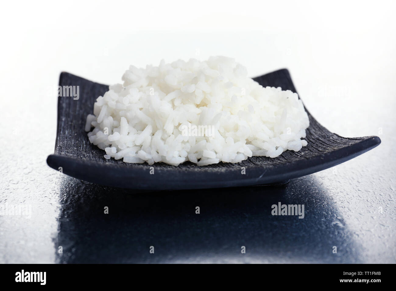 Cooked rice on grey background Stock Photo - Alamy