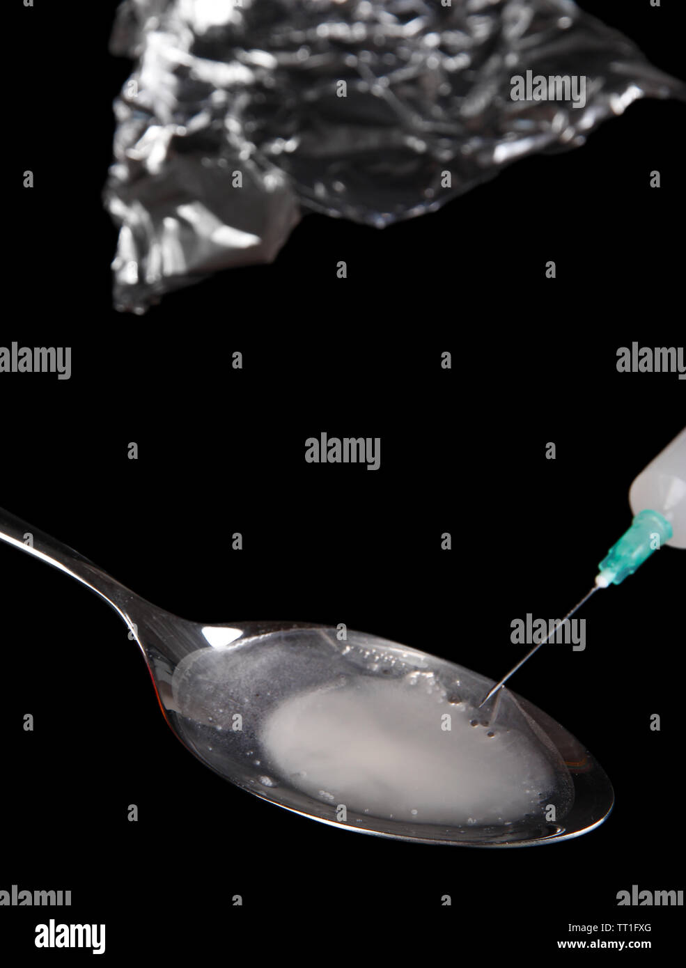 Heroin in spoon on black background Stock Photo - Alamy