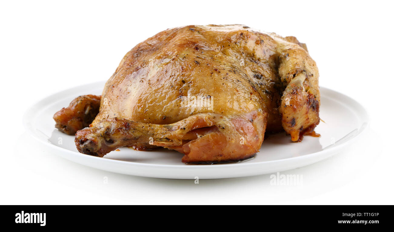 Whole roasted chicken on plate, isolated on white Stock Photo - Alamy