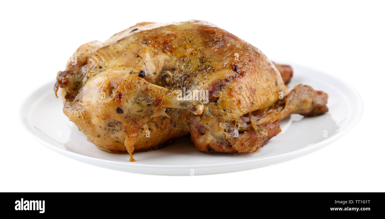 Whole roasted chicken on plate, isolated on white Stock Photo - Alamy