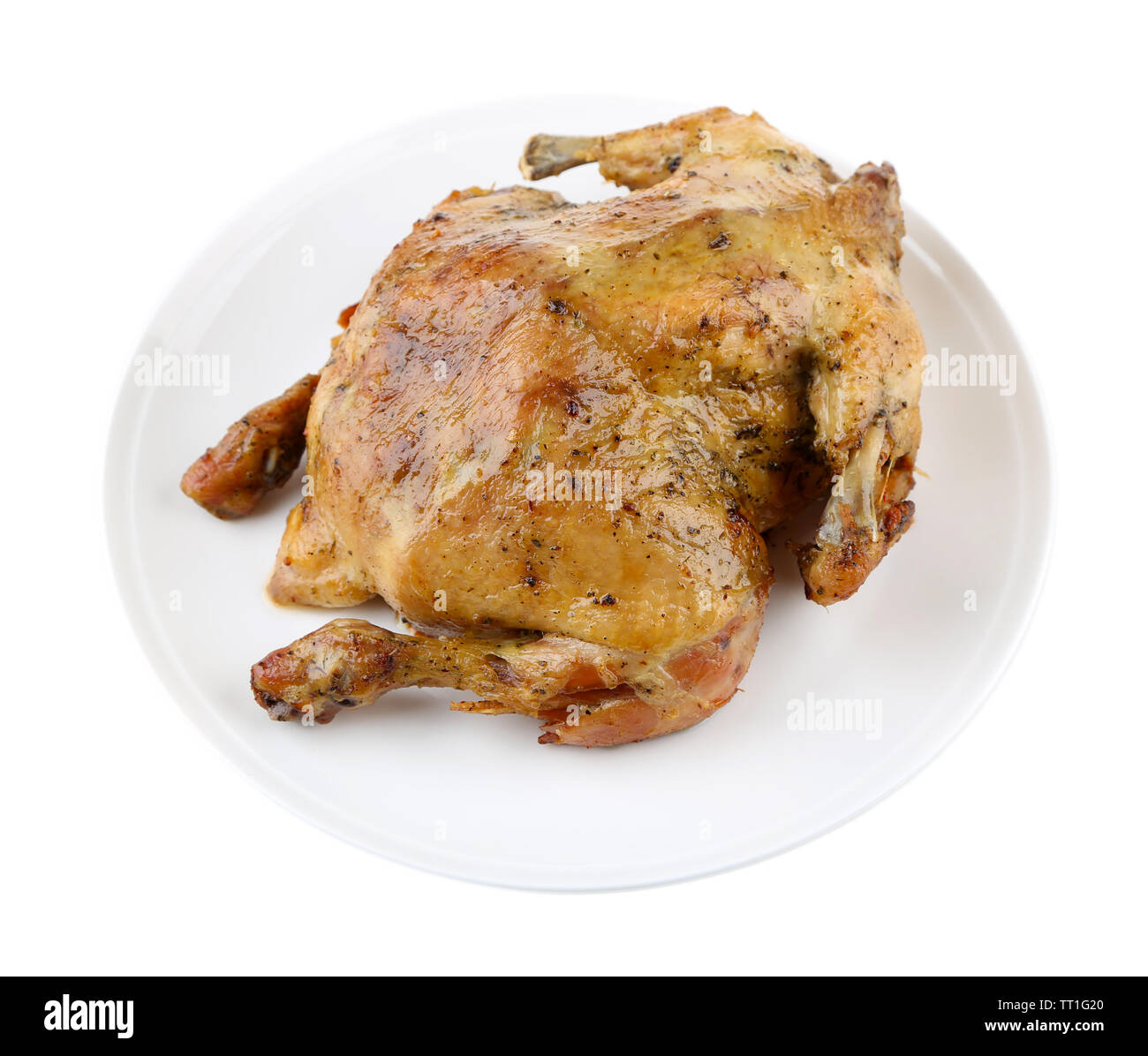 Whole roasted chicken on plate, isolated on white Stock Photo - Alamy