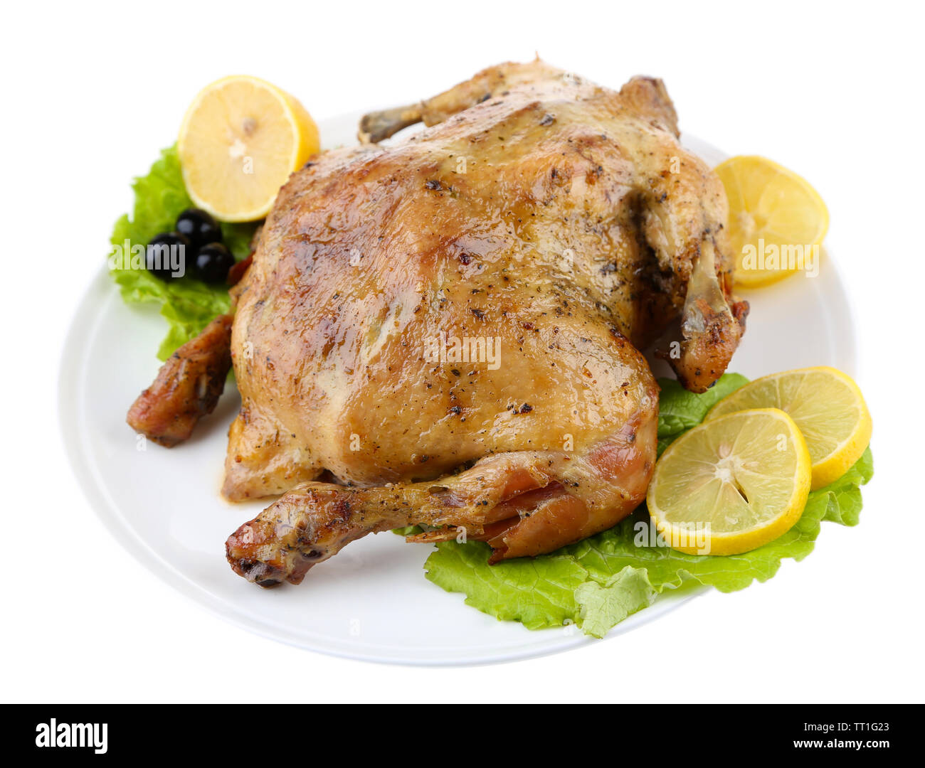 Whole roasted chicken with vegetables on plate, isolated on white Stock ...