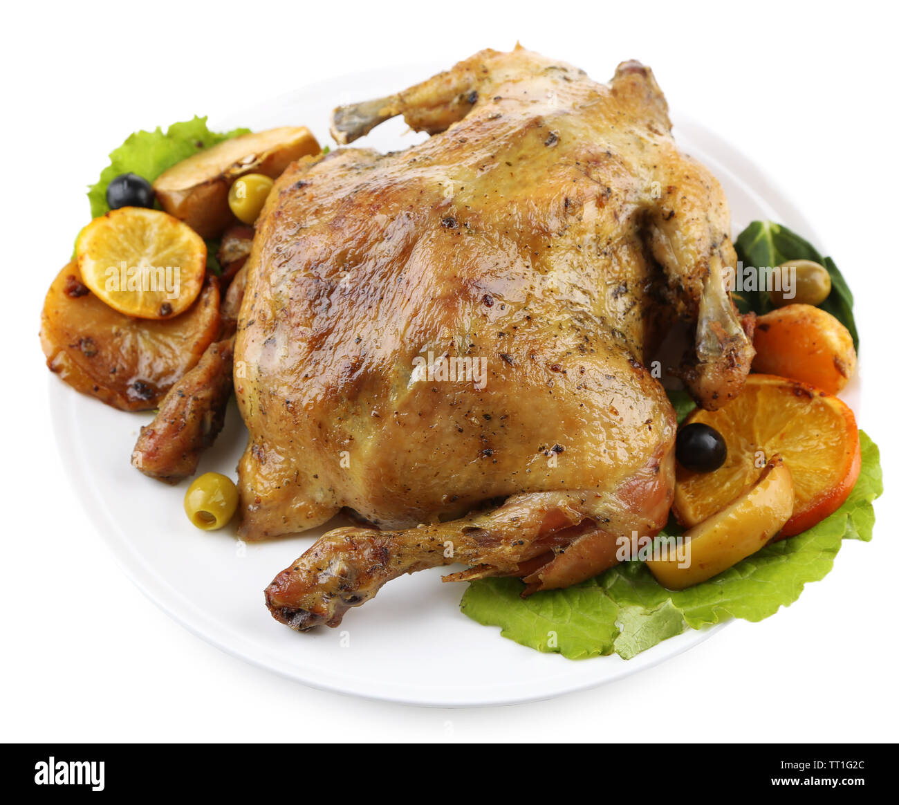 Whole roasted chicken with vegetables on plate, isolated on white Stock ...
