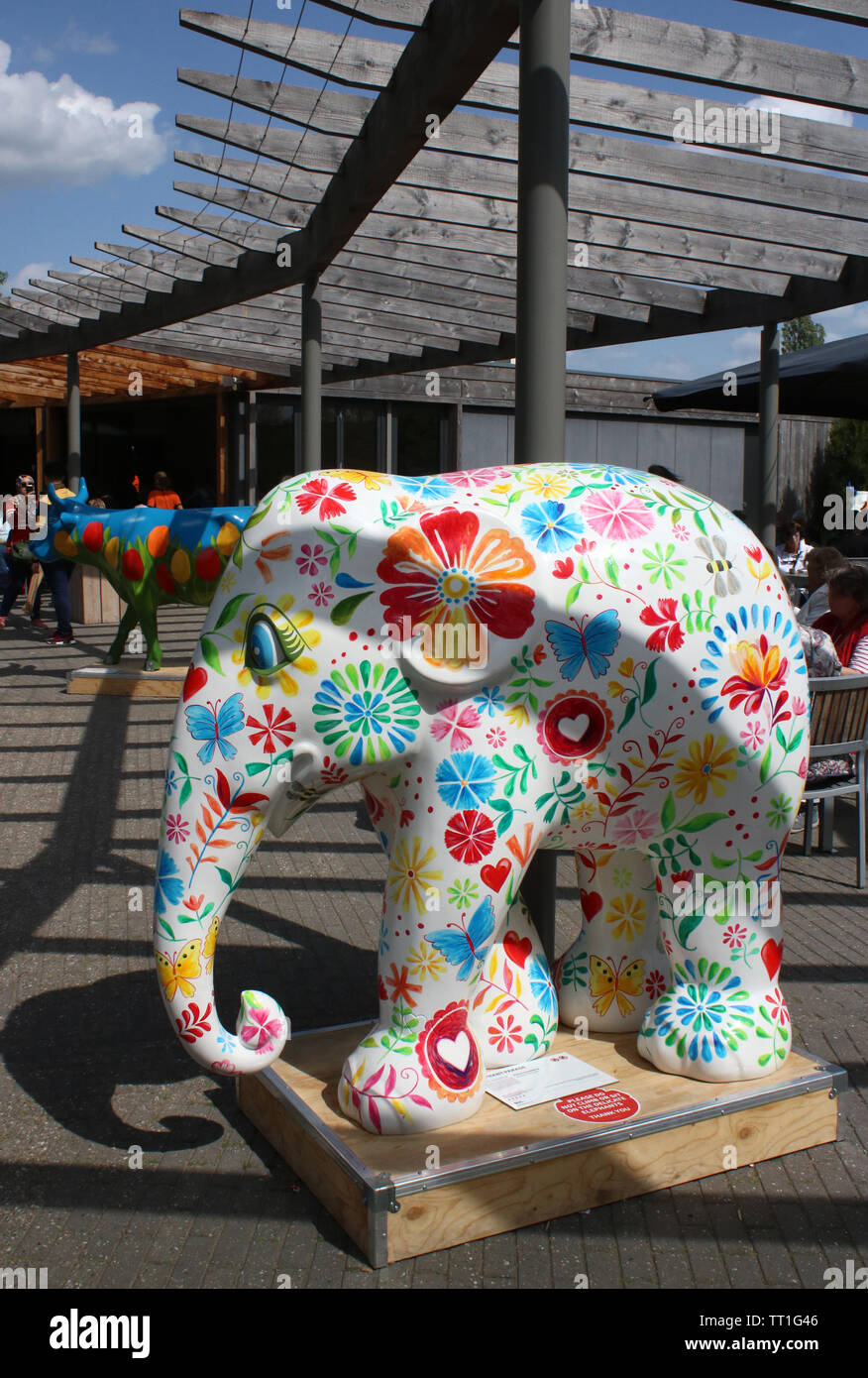 Colorful artwork in the form of a decorated elephant sculpture standing ...