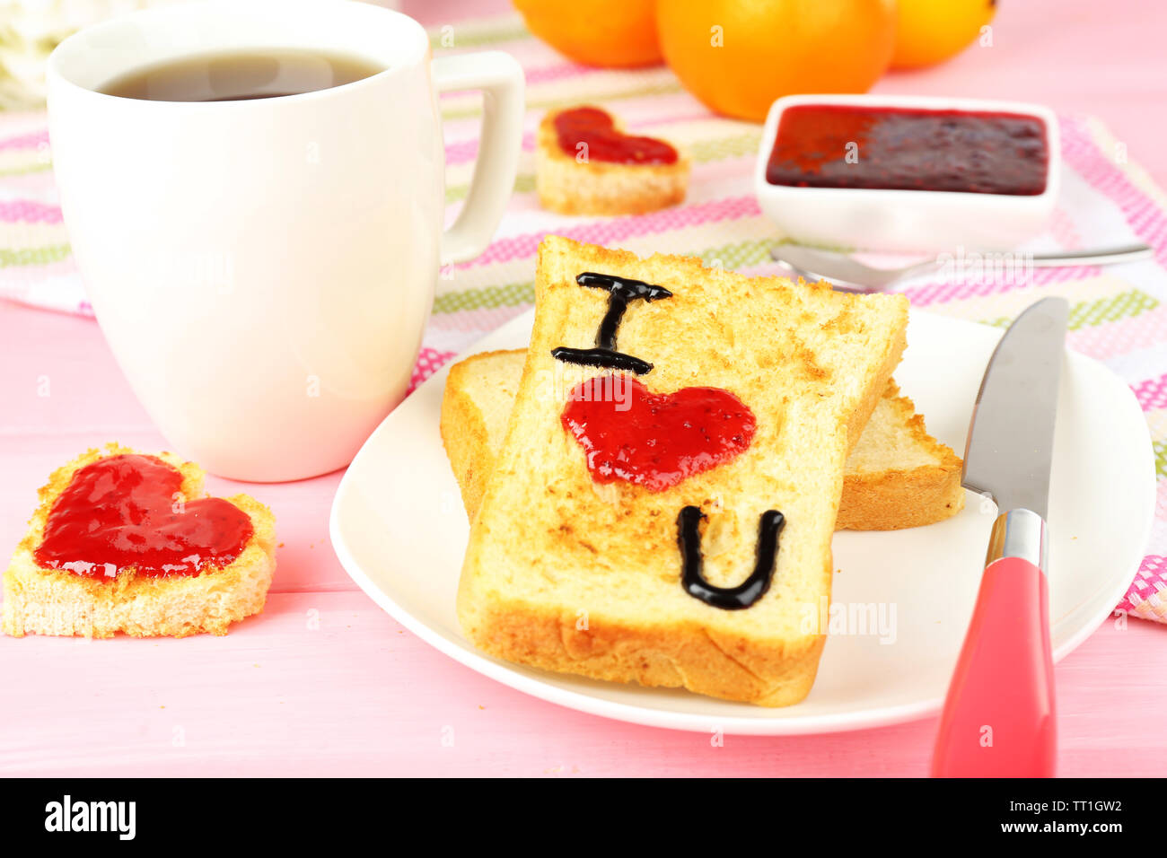 Delicious toast with jam and cup of tea on table close-up Stock Photo ...
