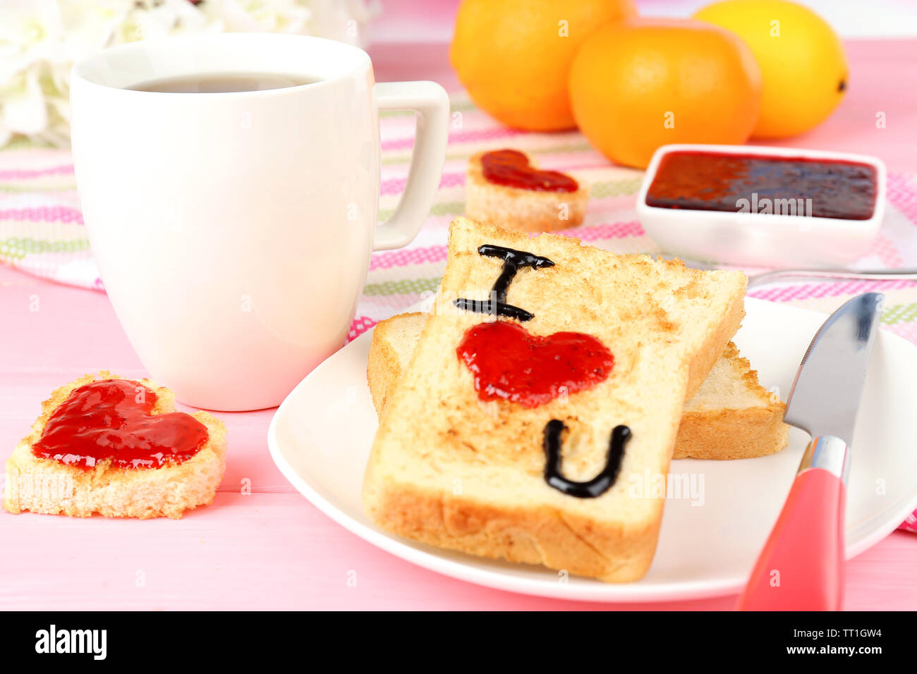 Delicious toast with jam and cup of tea on table close-up Stock Photo ...