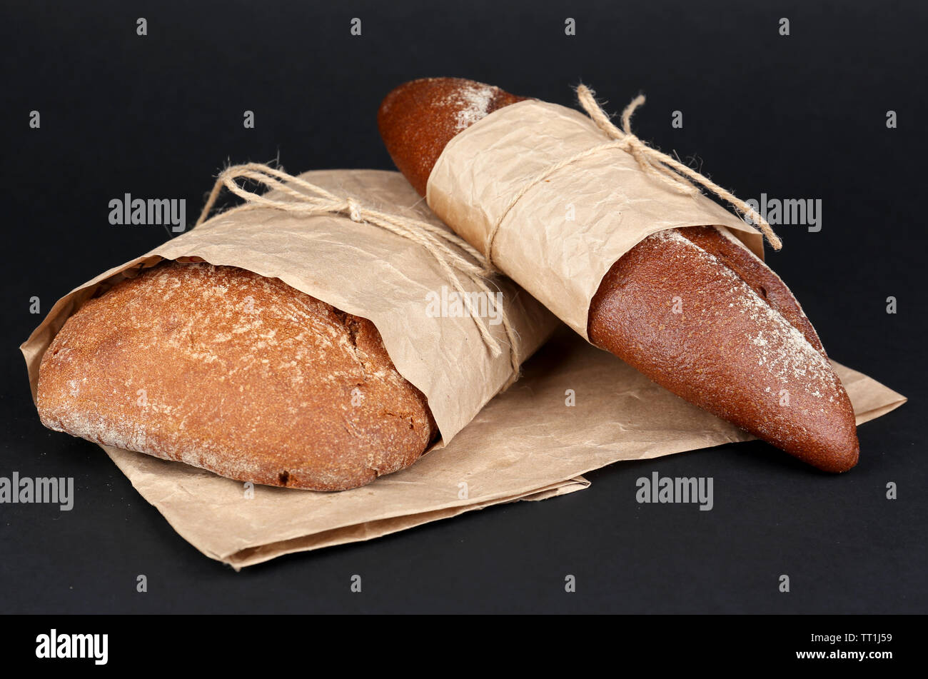 Different types of bread on black background, close-up Stock Photo - Alamy