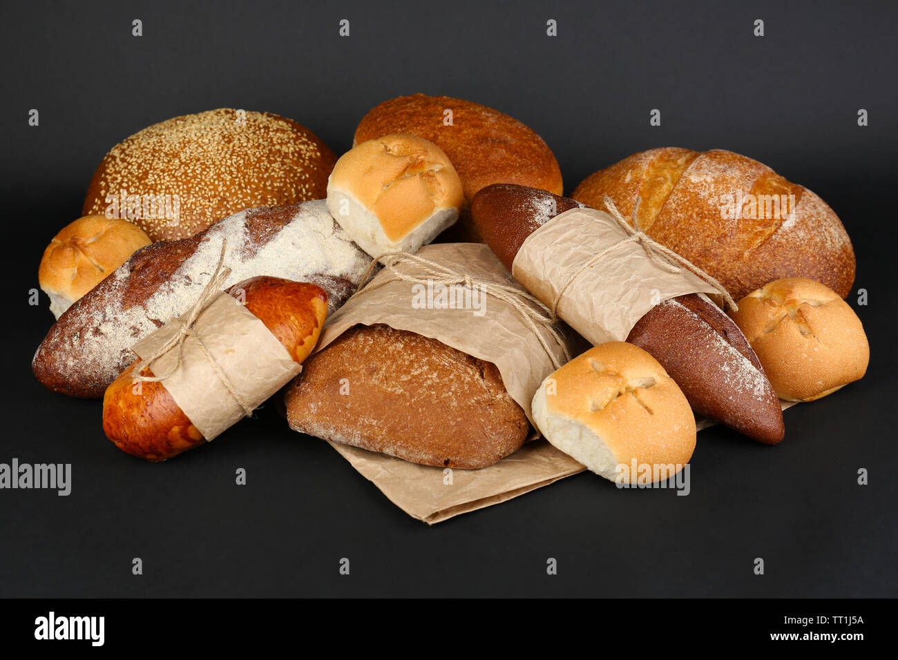 Different types of bread on black background, close-up Stock Photo - Alamy