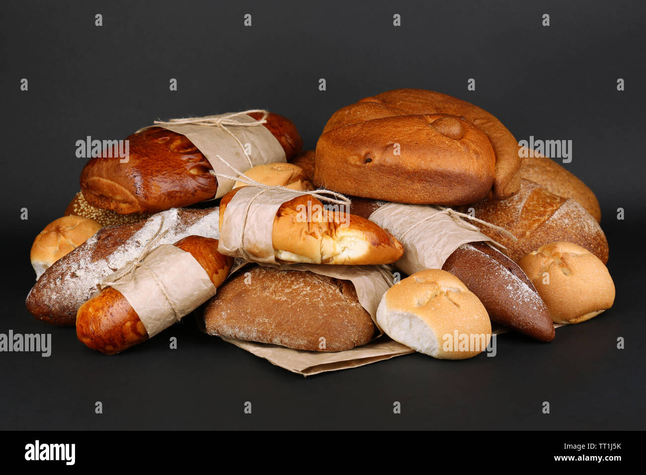 Different types of bread on black background, close-up Stock Photo - Alamy