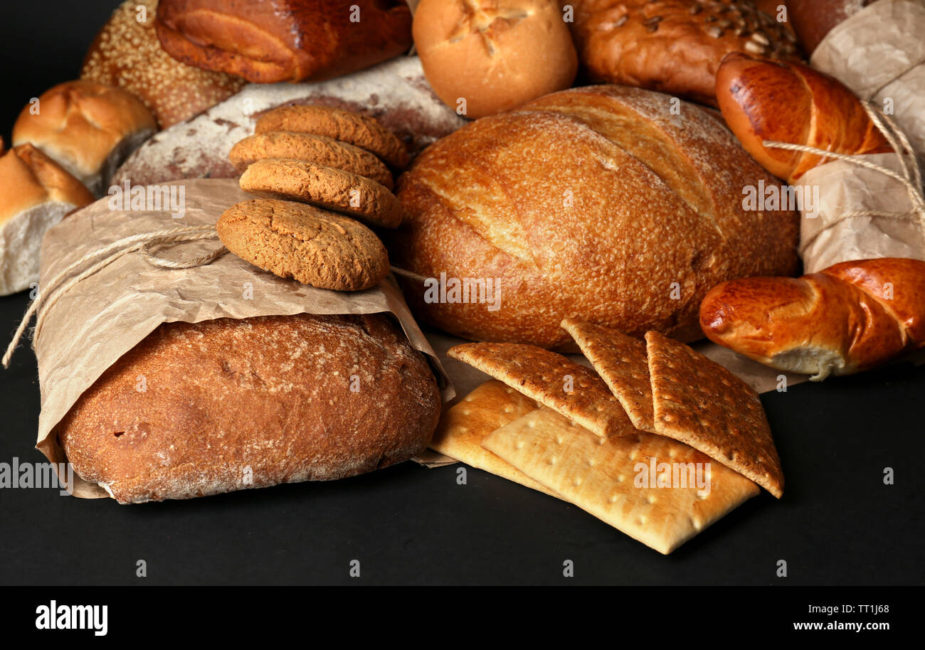 Different types of bread on black background, close-up Stock Photo - Alamy