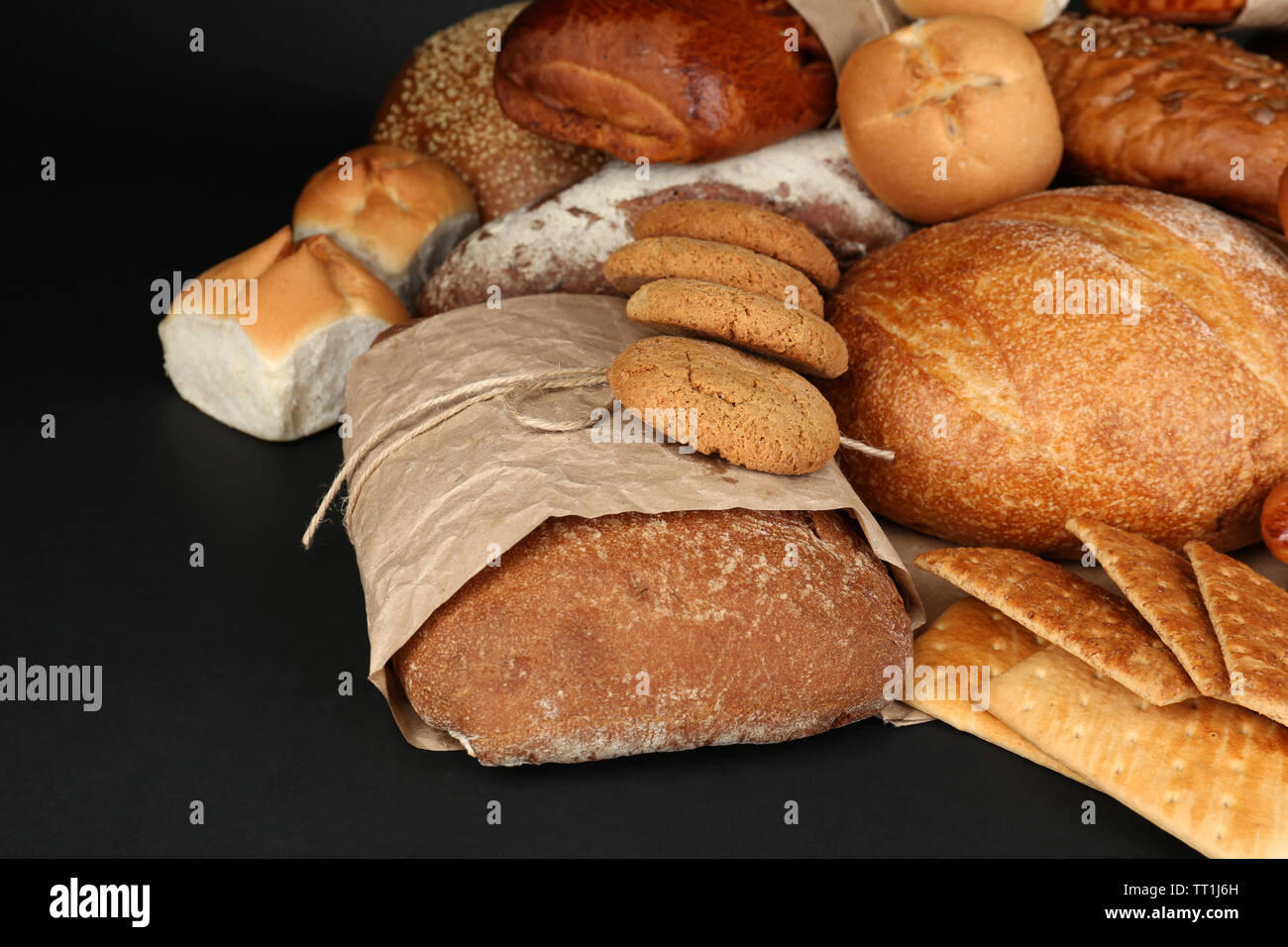 Different types of bread on black background, close-up Stock Photo - Alamy