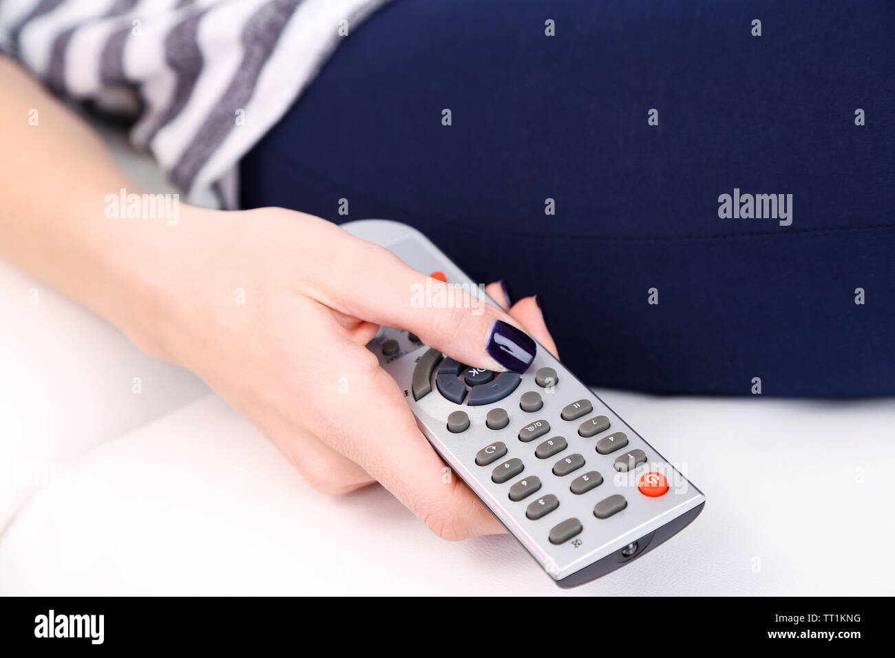 Female hand with TV remote control, close-up Stock Photo - Alamy