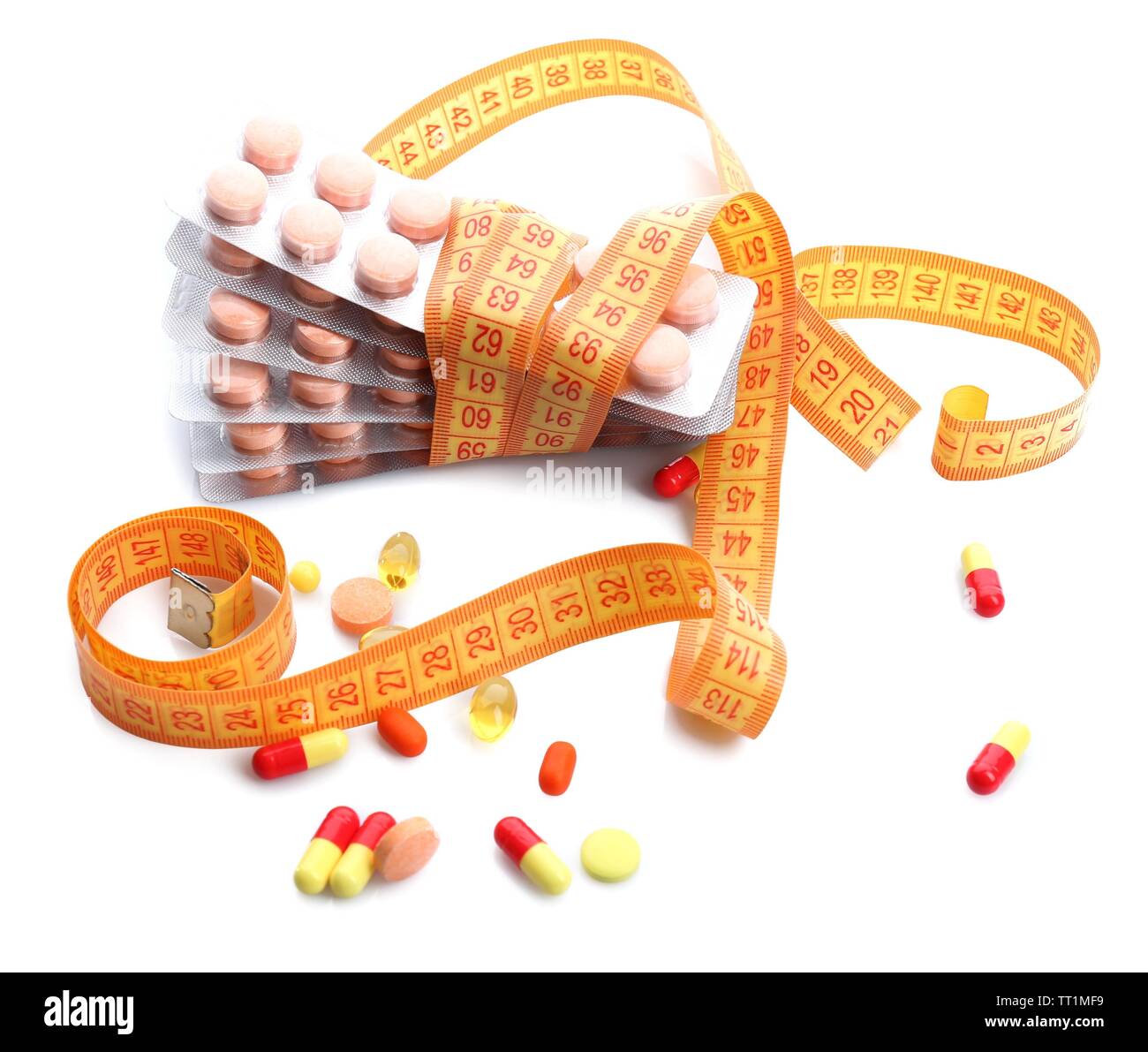 Measuring tape and pills, isolated on white. Dieting concept Stock ...