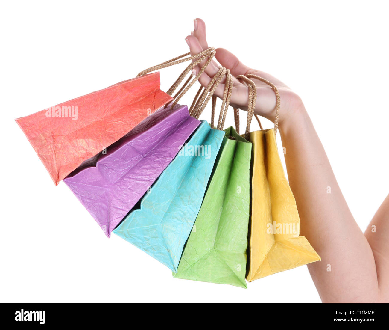 Colorful shopping bags in female hand, isolated on white Stock Photo ...