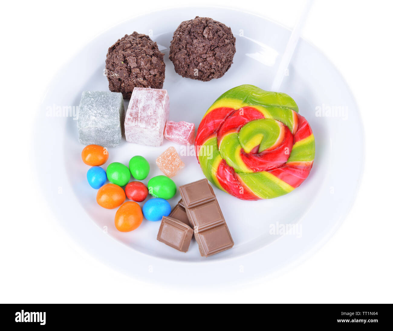 Different sweets on plate isolated on white Stock Photo - Alamy
