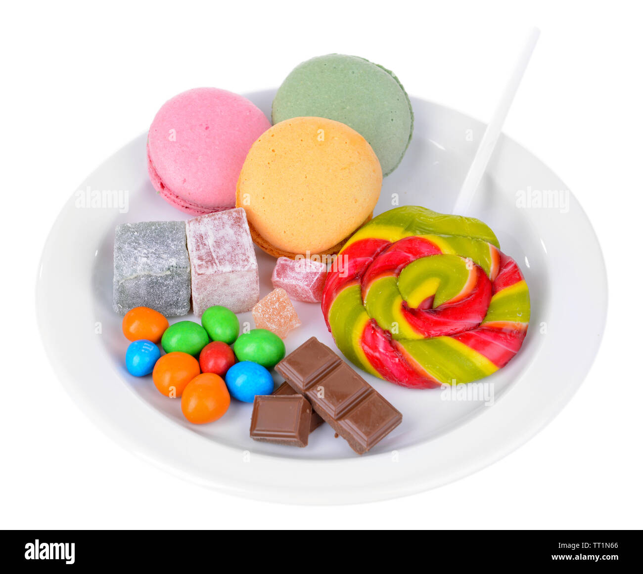 Different sweets on plate isolated on white Stock Photo - Alamy