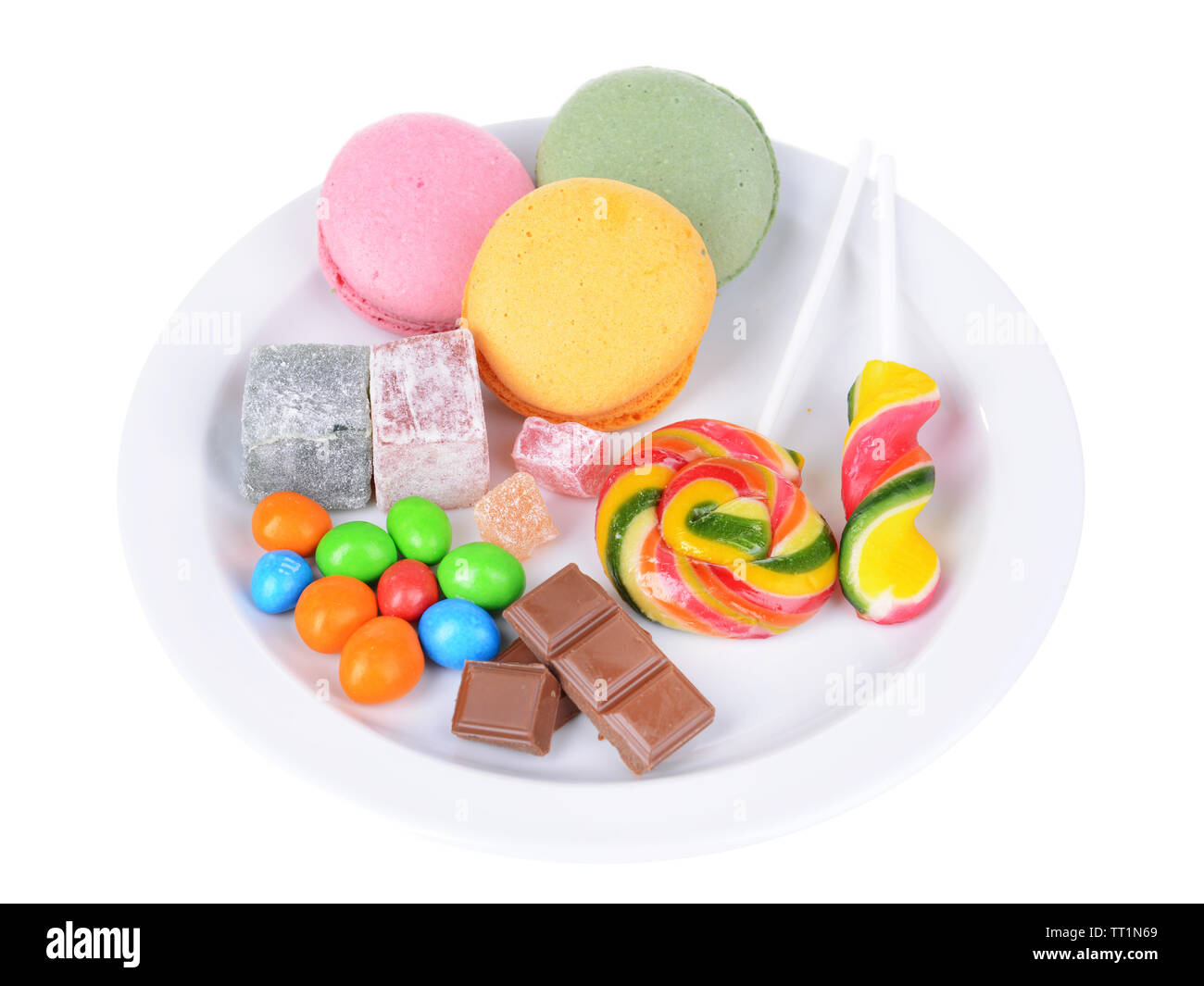 Different sweets on plate isolated on white Stock Photo - Alamy