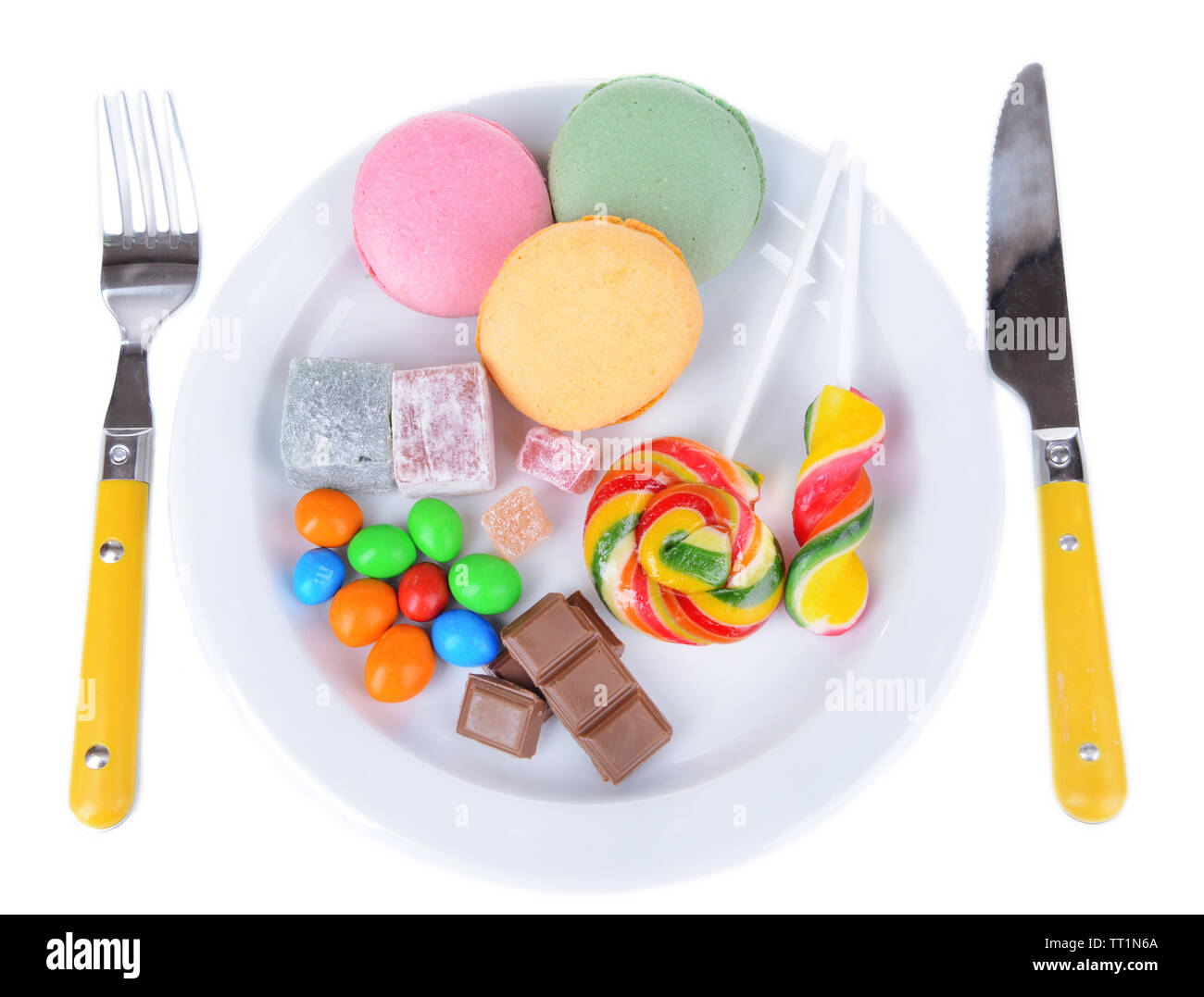 Different sweets on plate isolated on white Stock Photo - Alamy